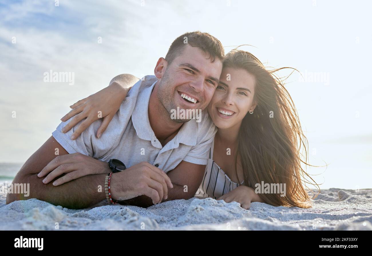 Portrait, love and relax couple, beach and holiday in summer sunset ...