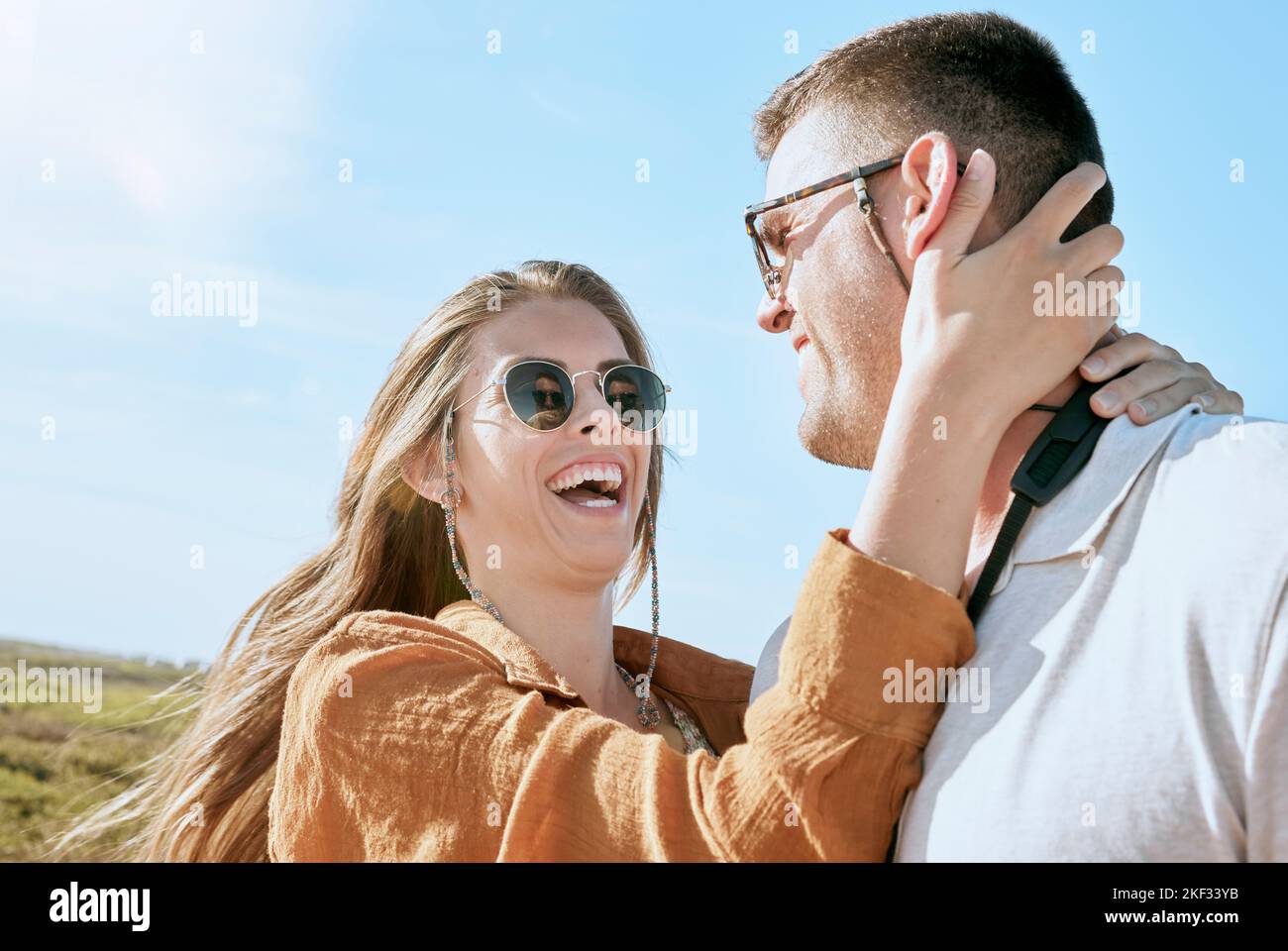 Couple, travel and hug on a vacation adventure laughing on a walk ...