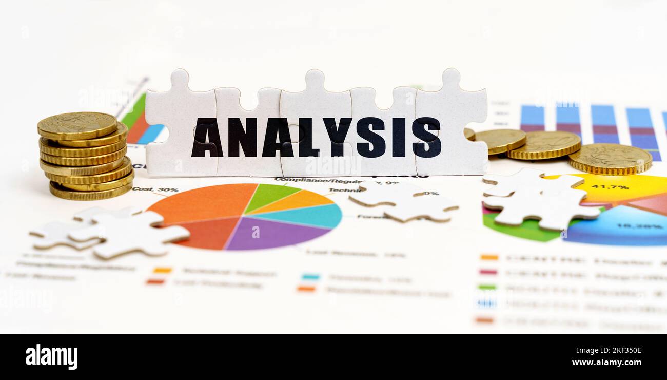 Business and Economics. There are coins and puzzles on financial charts ...