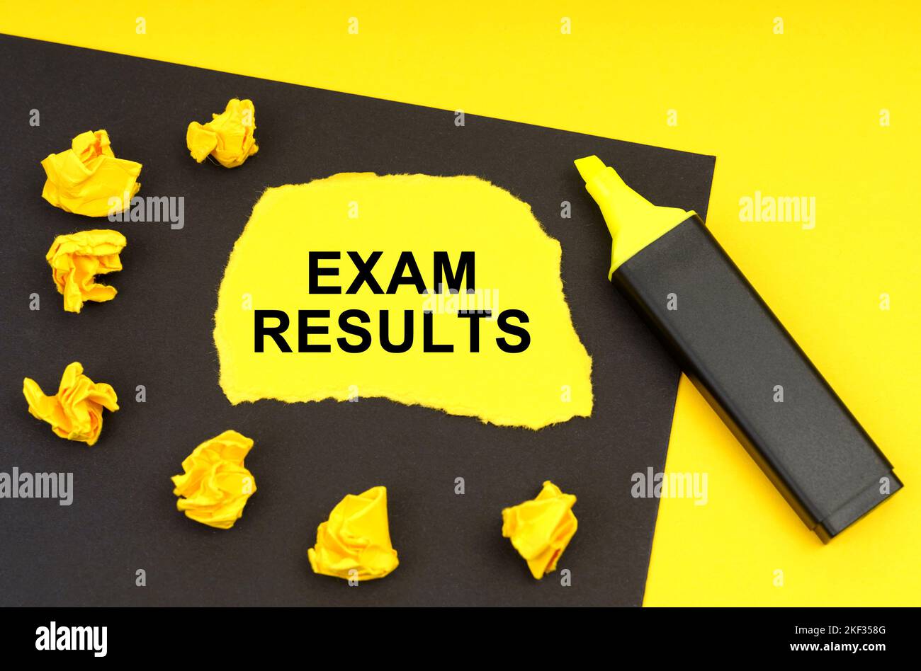 Business and education concept. On a yellow background, a black sheet ...