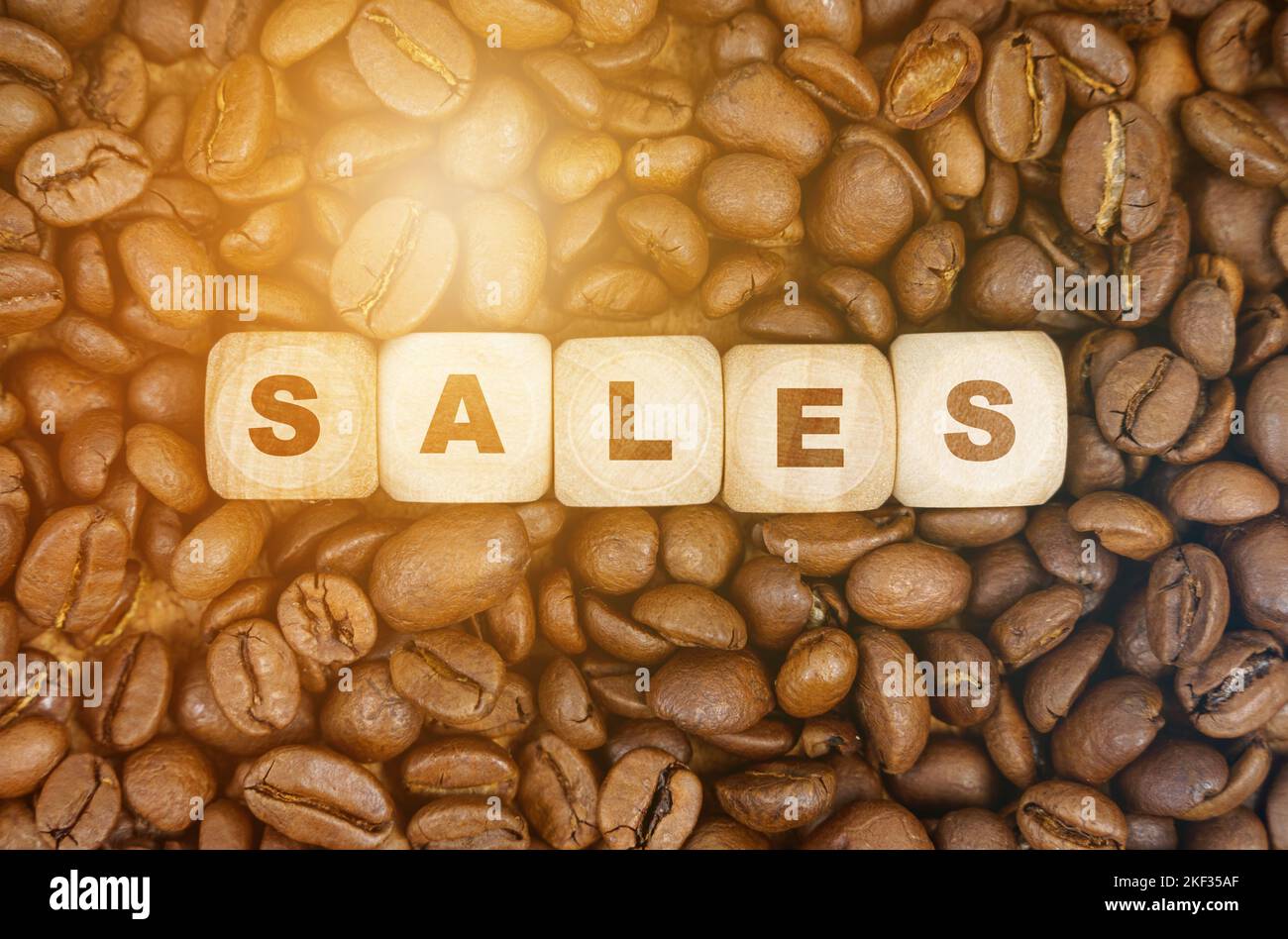 Coffee business. Among the coffee beans are cubes that say - SALES ...