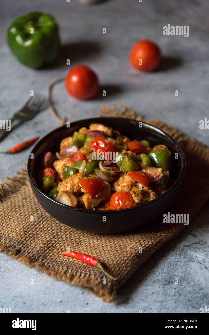 Cooked food stir fried chicken in a bowl. Close up Stock Photo - Alamy