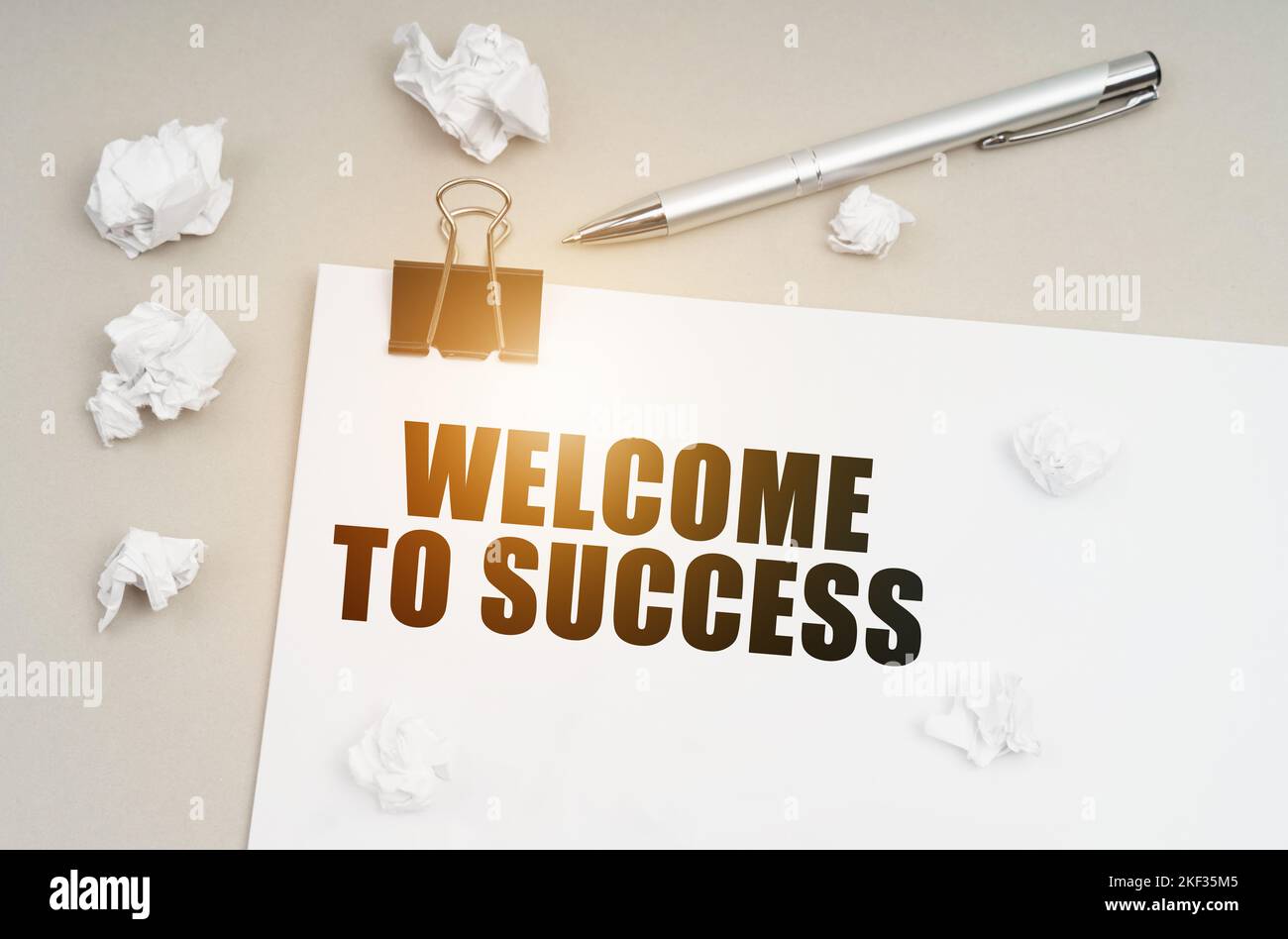 Economy and business concept. On a gray surface, a pen, crumpled paper ...