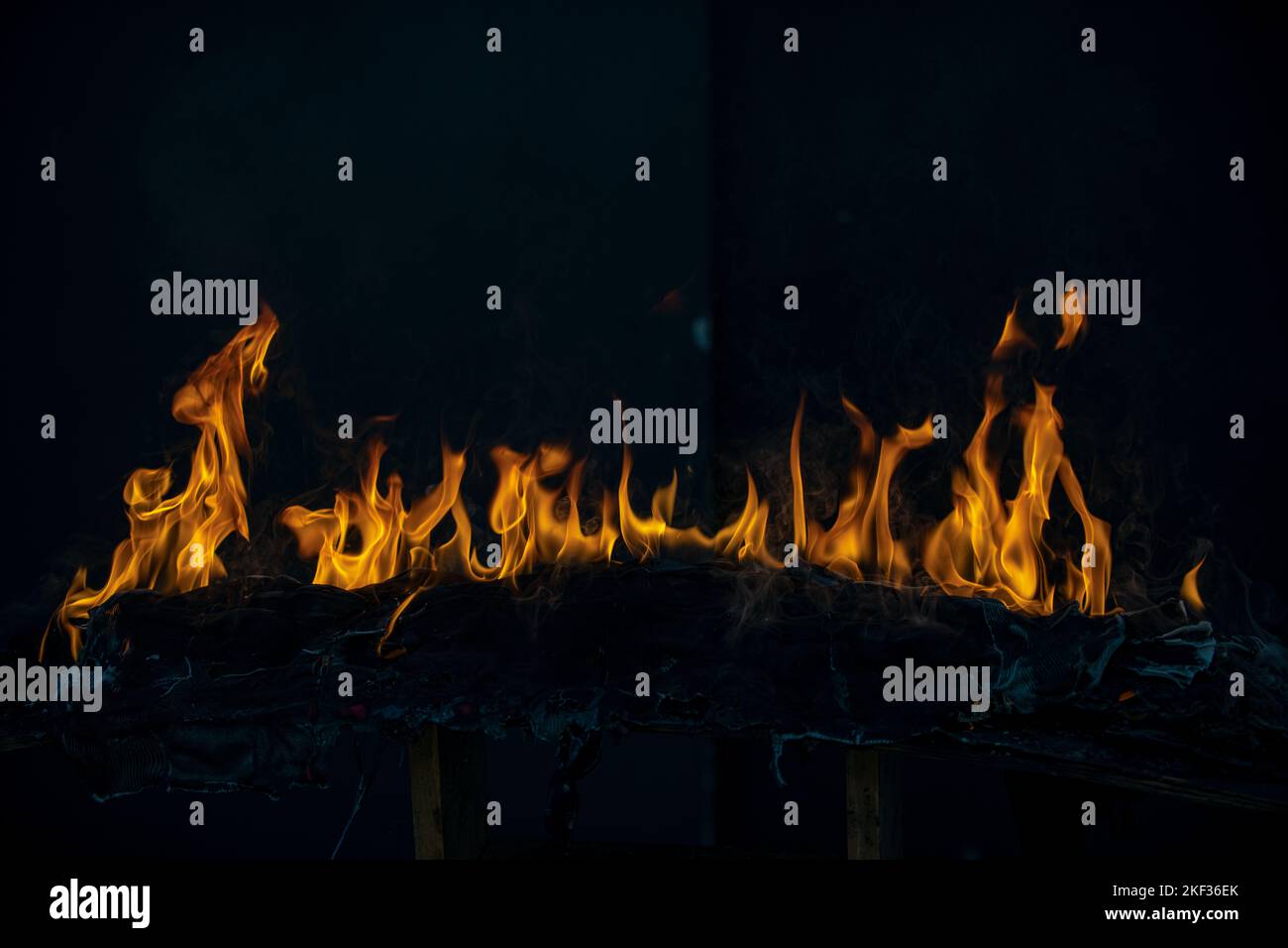 Fire flame burning and fire glowing on black background Stock Photo - Alamy