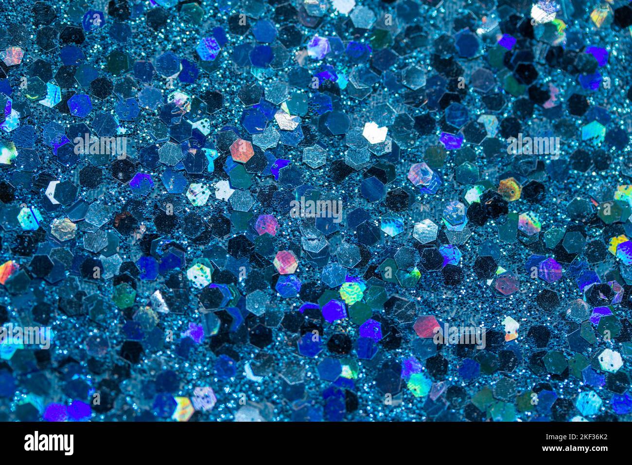 Full frame macro image of a blue color sparkling glitter texture ...