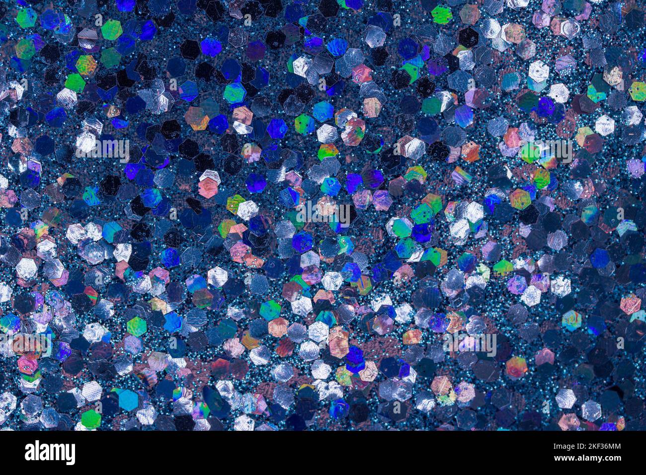 Full frame macro image of a blue color sparkling glitter texture ...