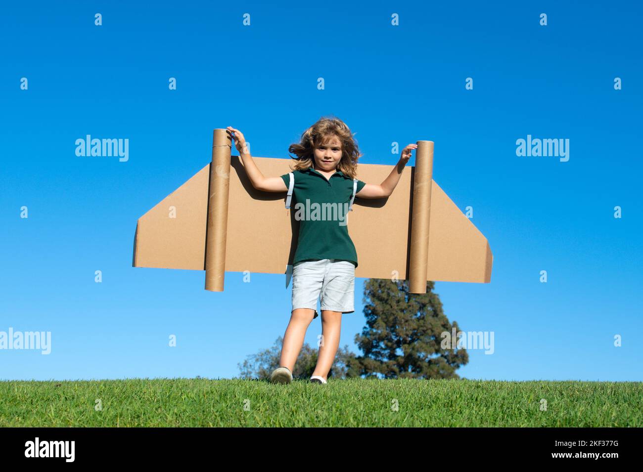 Child boy plays in an astronaut dreams of space. Happy child play with ...