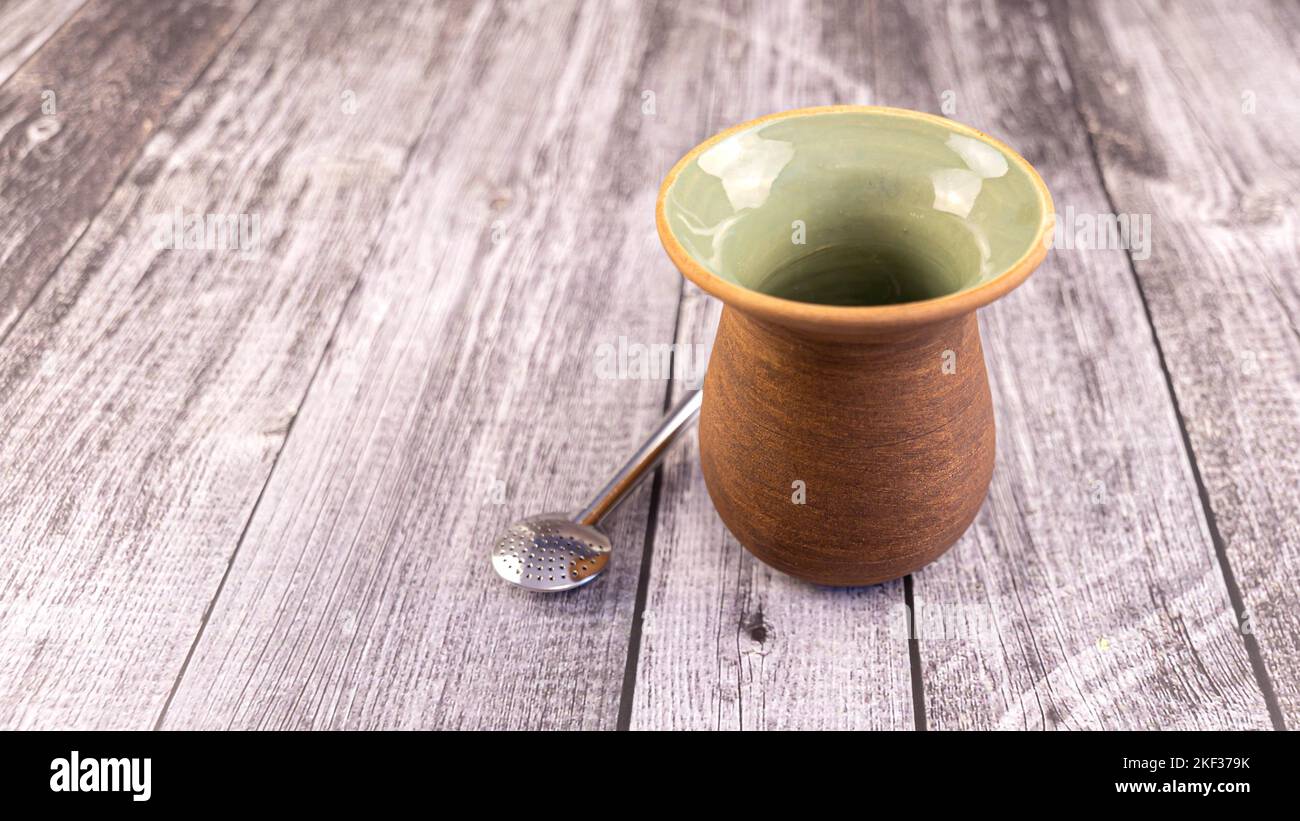 Clay mate calabash with bombilla on grey wood background Stock Photo ...