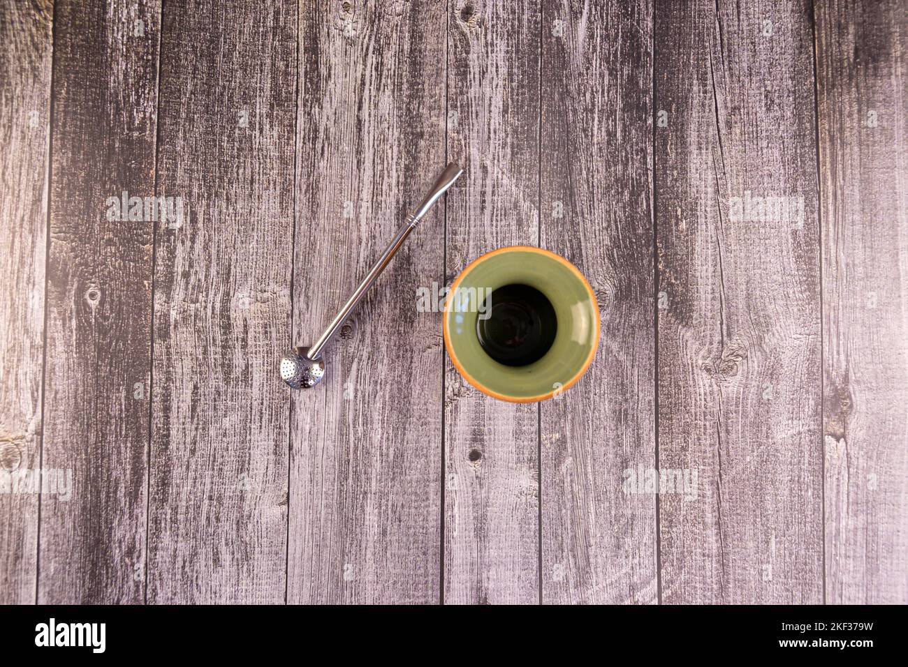 Clay mate calabash with bombilla on grey wood background Stock Photo ...