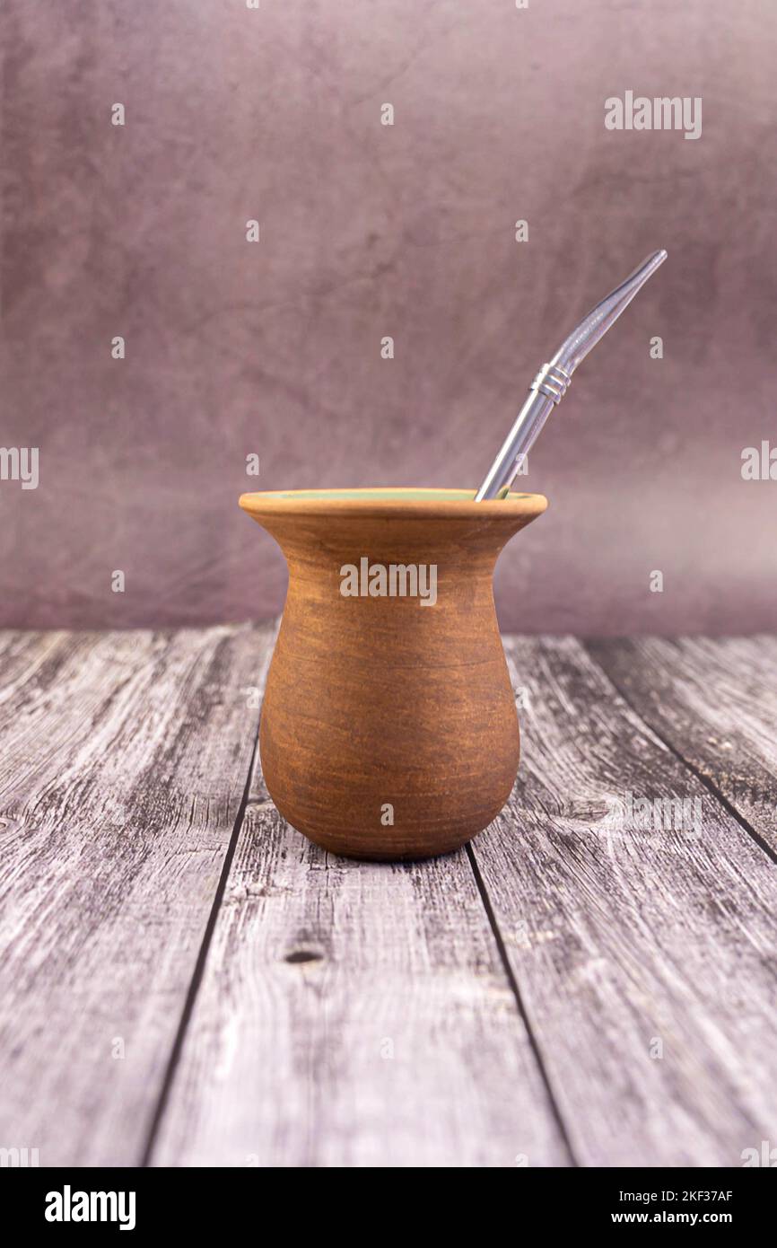 Clay mate calabash with bombilla on grey wood background Stock Photo ...