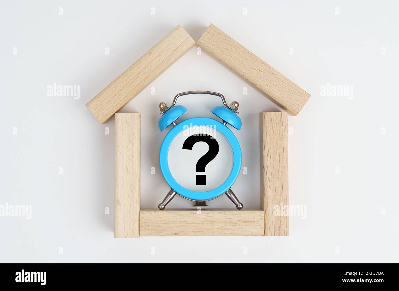 Business concept. On a white background, a small house made of wooden ...