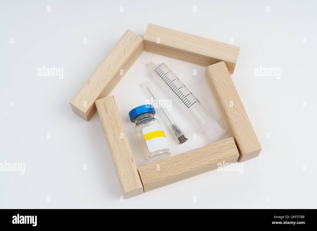 Business concept. On a white background a small house made of wooden ...