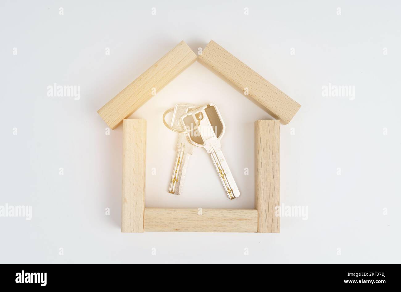 Business concept. On a white background, a small house made of wooden ...