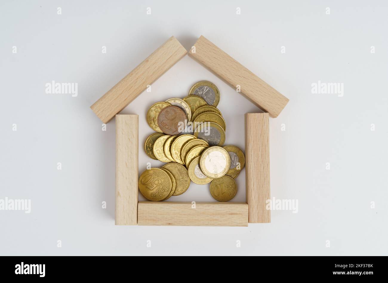Business concept. On a white background, a small house made of wooden ...
