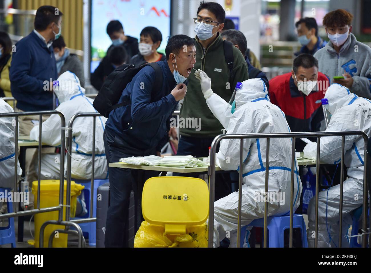 NANJING, CHINA - NOVEMBER 15, 2022 - Departing passengers line up for ...