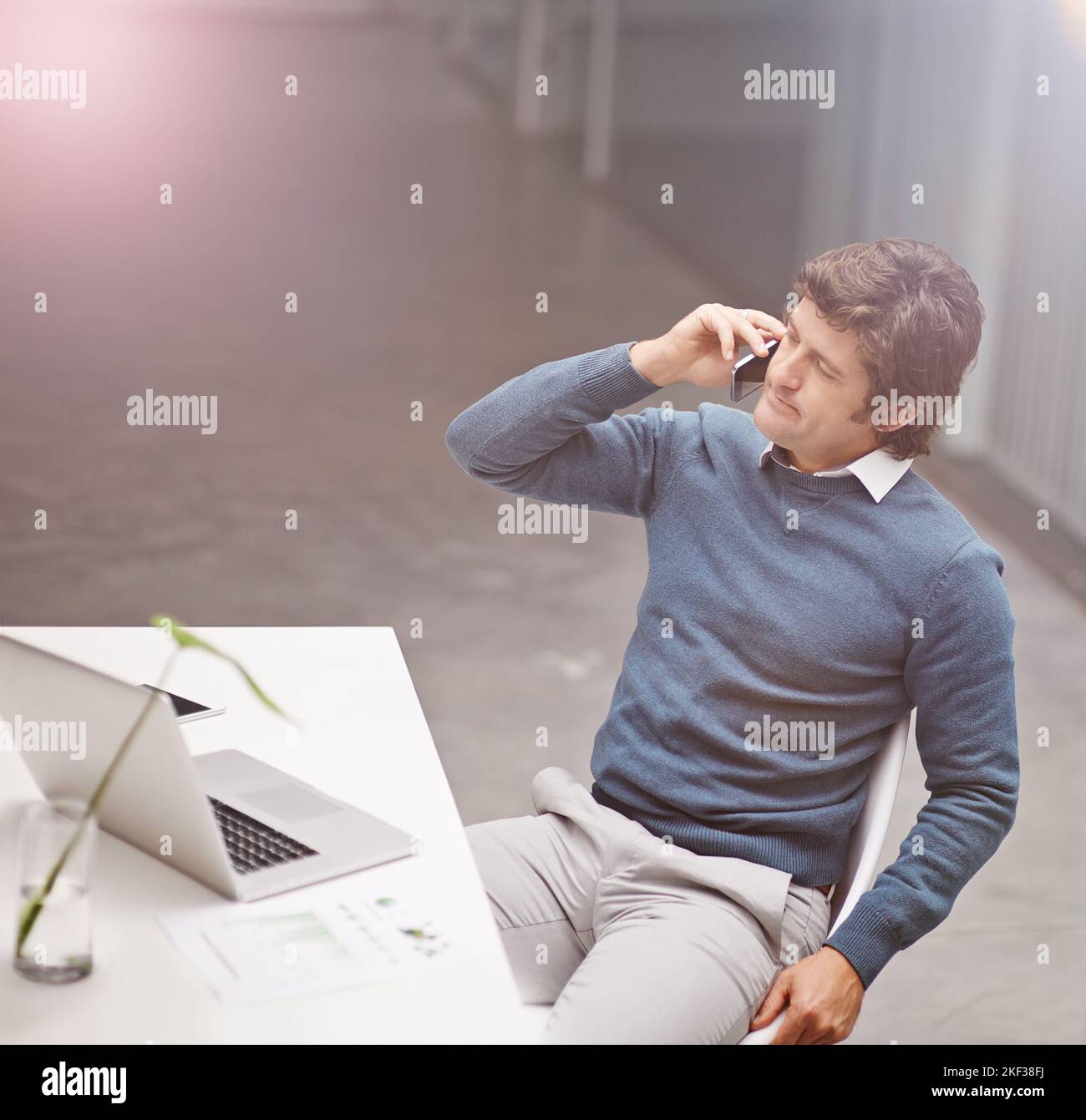 Confirming an appointment with his client. a businessman using a phone ...