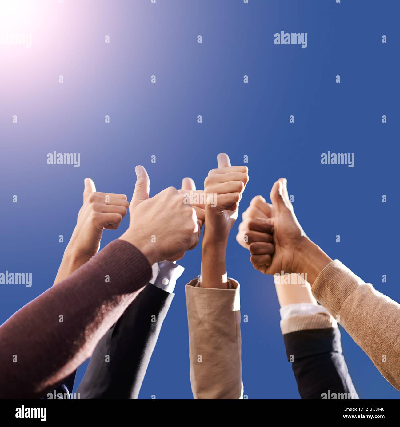Yes. businesspeople showing thumbs up against a blue background Stock ...