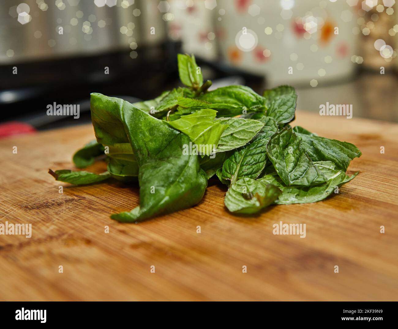 Fresh basil leaves lie on wooden board for cooking Stock Photo - Alamy