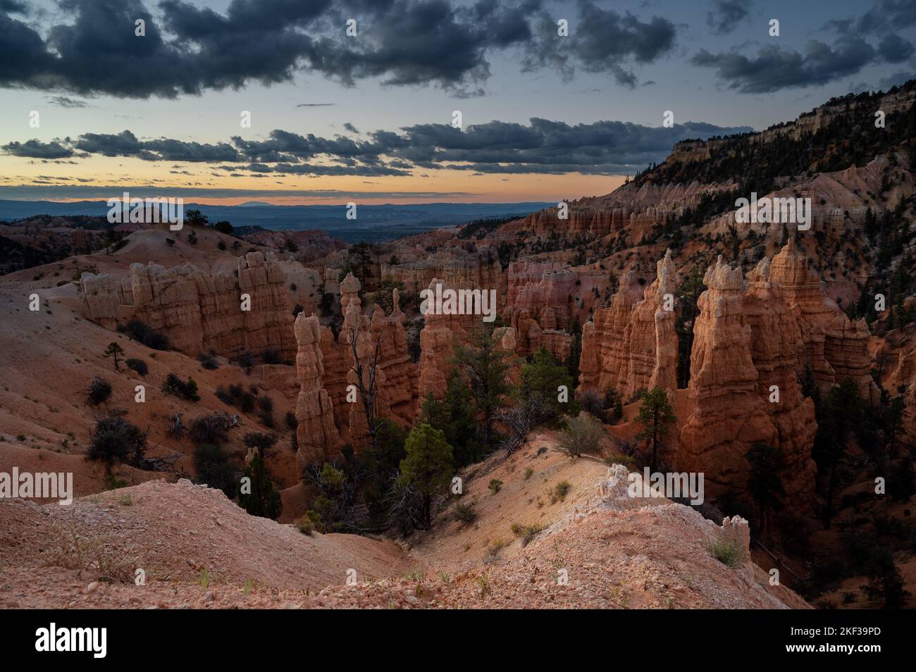 A red rocky canyon with golden sunset background Stock Photo - Alamy