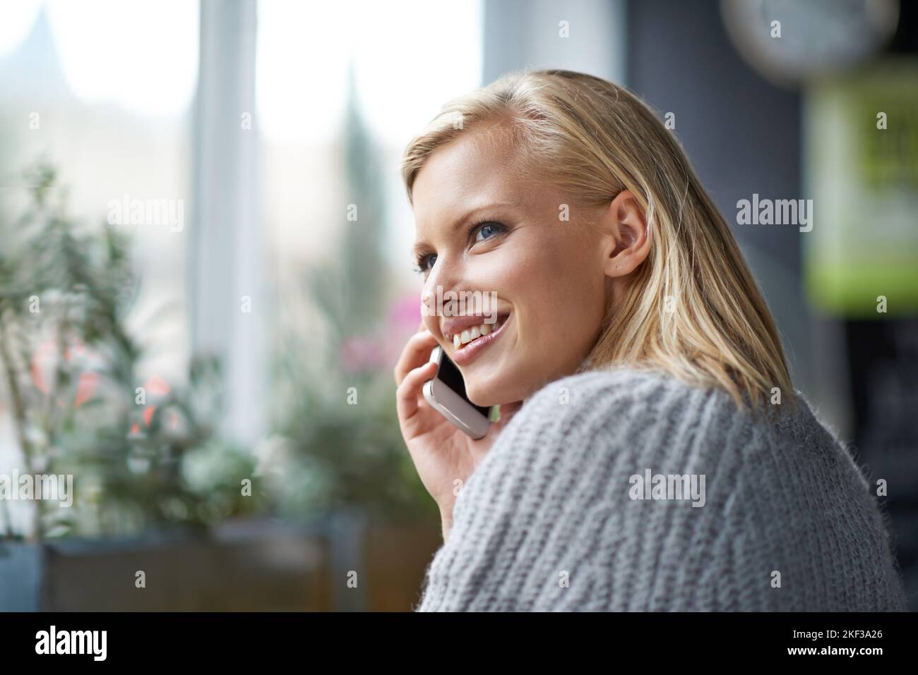 Meet me at the coffee shop. A young woman sitting in a restaurant ...