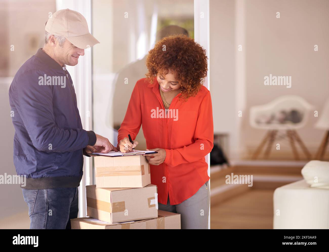 Signing for package hi-res stock photography and images - Alamy