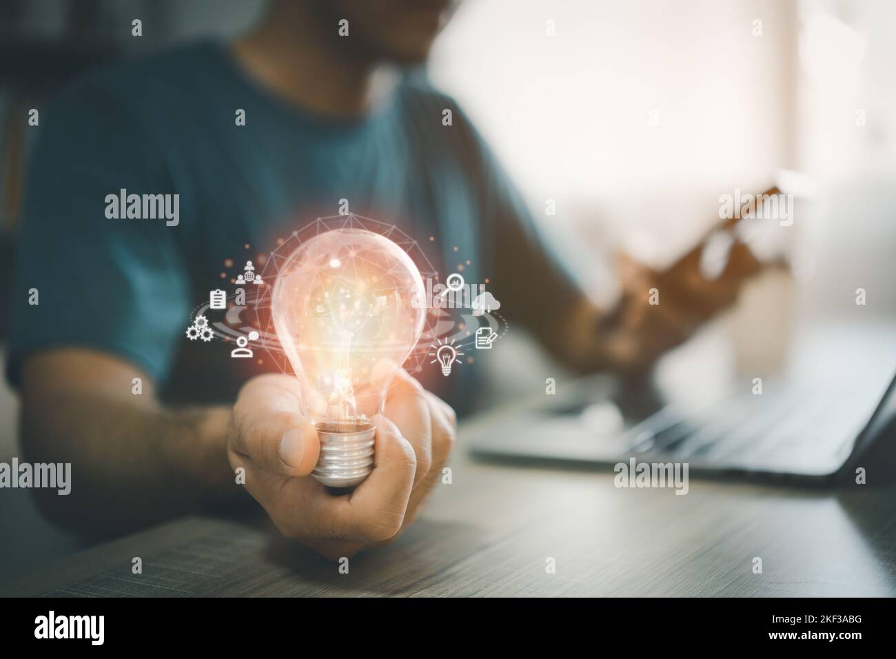 Man hand holding light bulb global Internet connection while working on ...