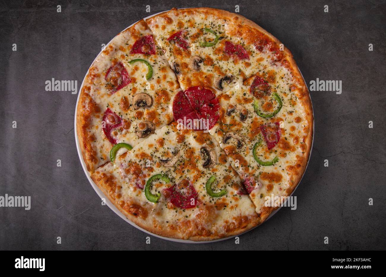 Tasty peroni pizza on rustic background. Top view of hot pepperoni ...