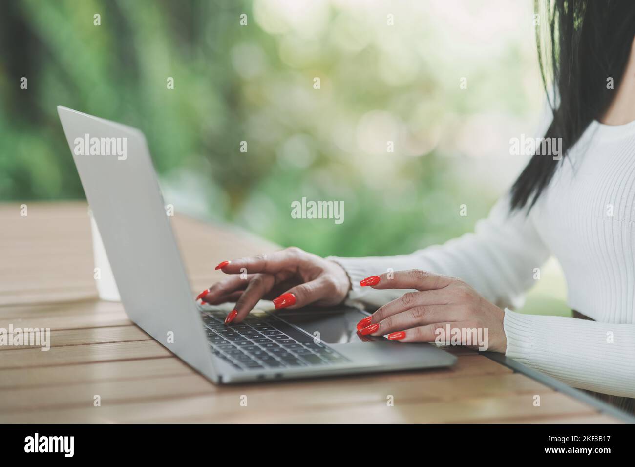 Crop image of asian freelance woman smile typing on keyboard and ...