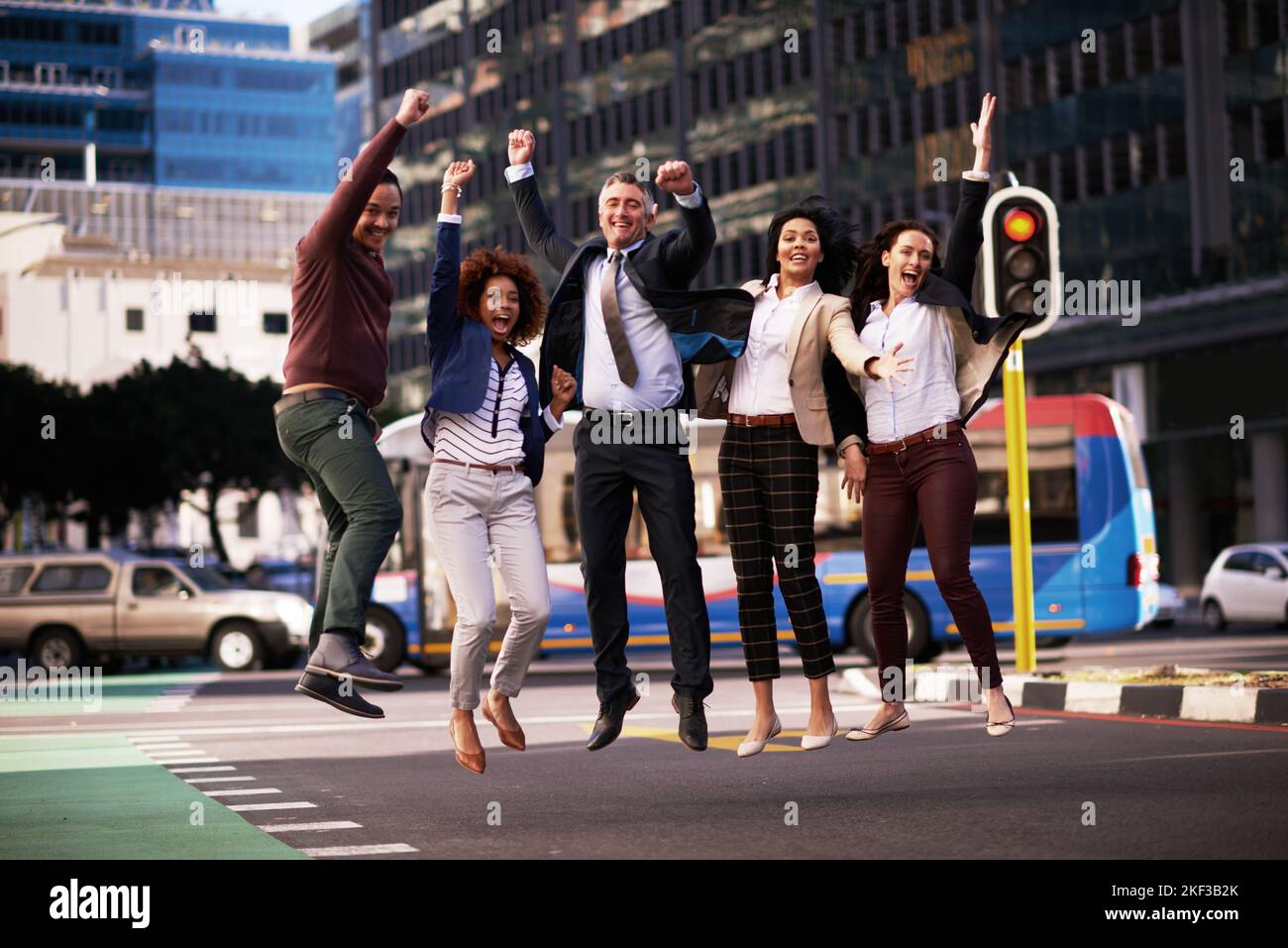 Jump if youre in the best team ever. a motivated business team jumping ...