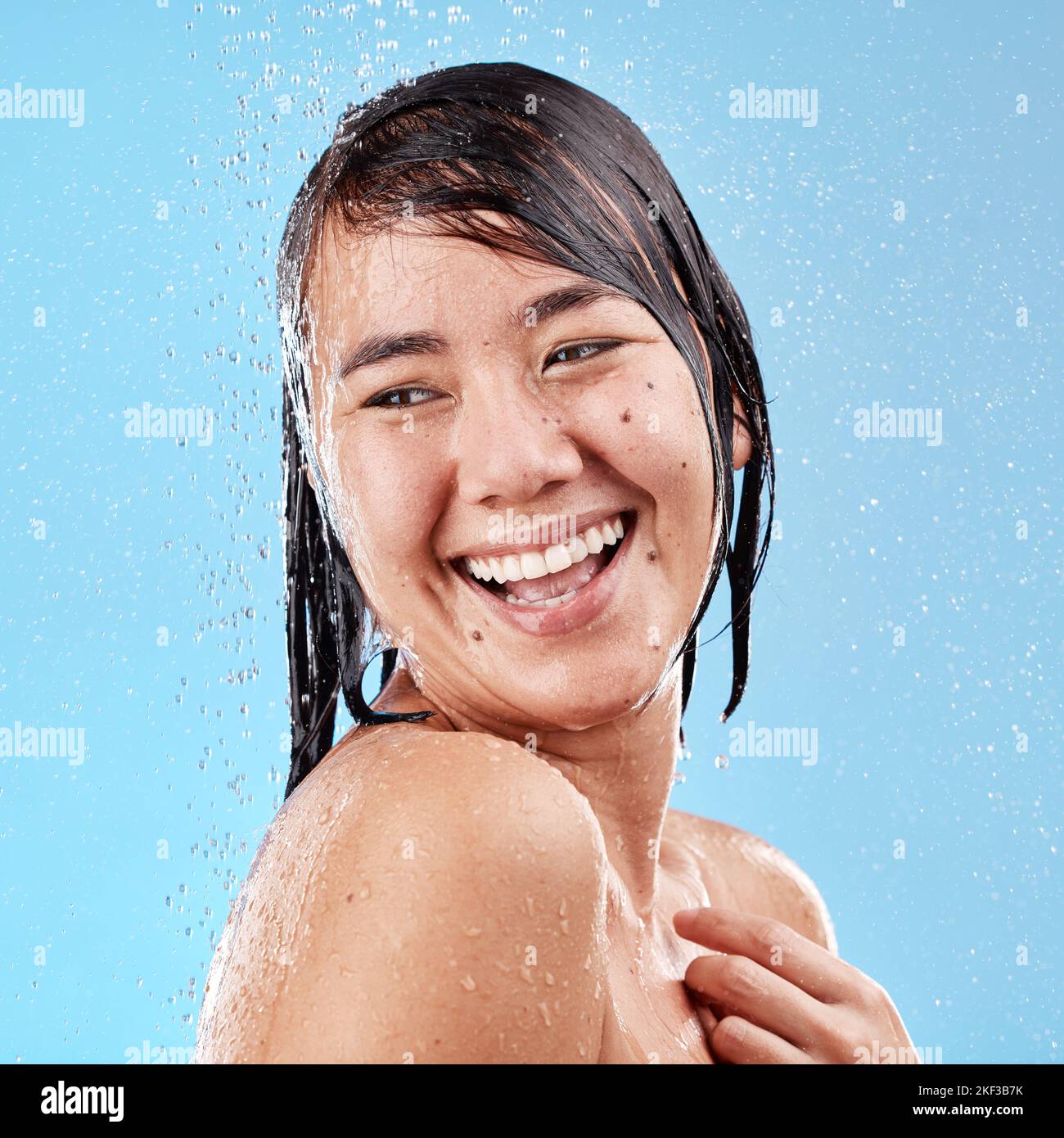 Shower, water drops and skincare woman in studio for beauty, cosmetics cleaning and facial ...