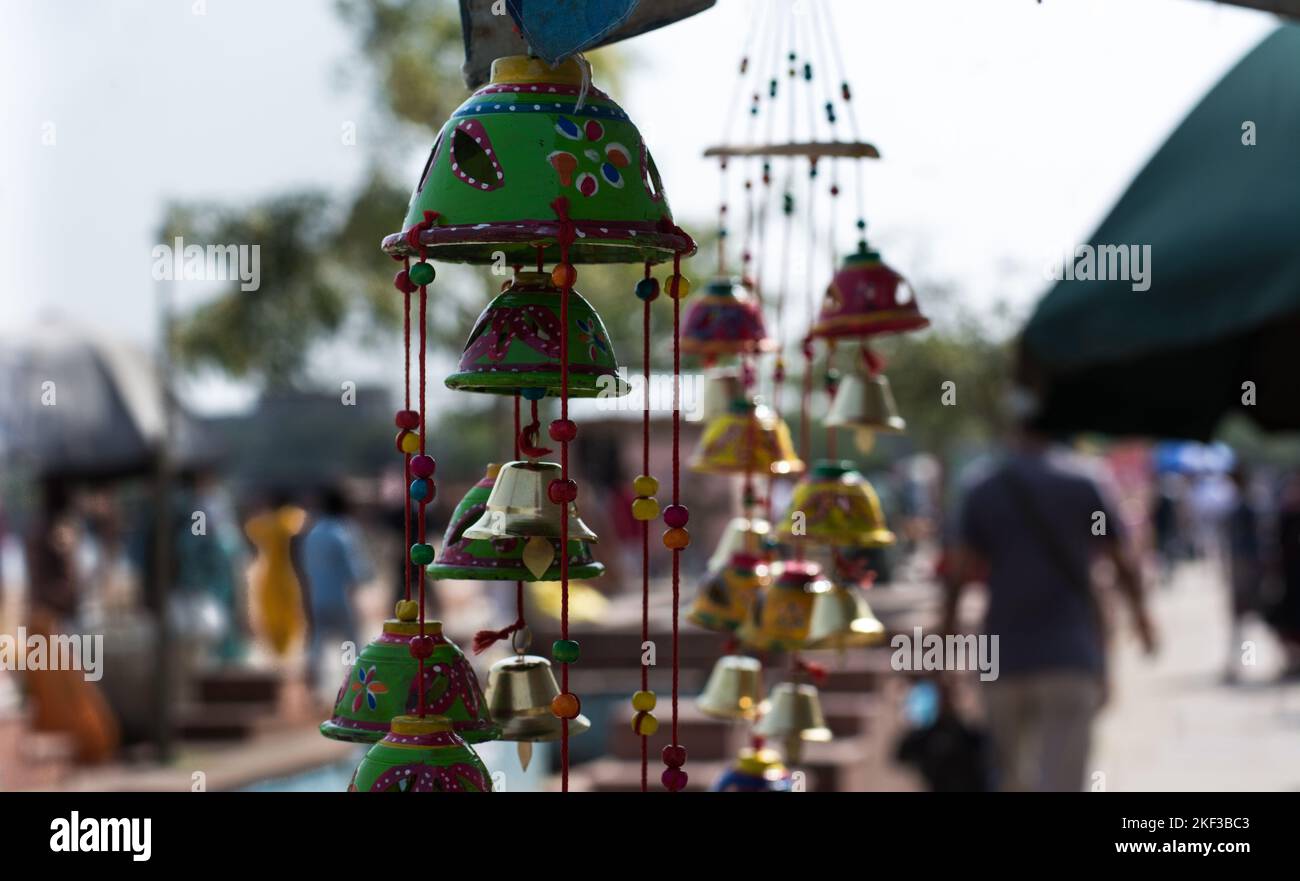 Indian handicraft items hanging on a shop in India Stock Photo - Alamy