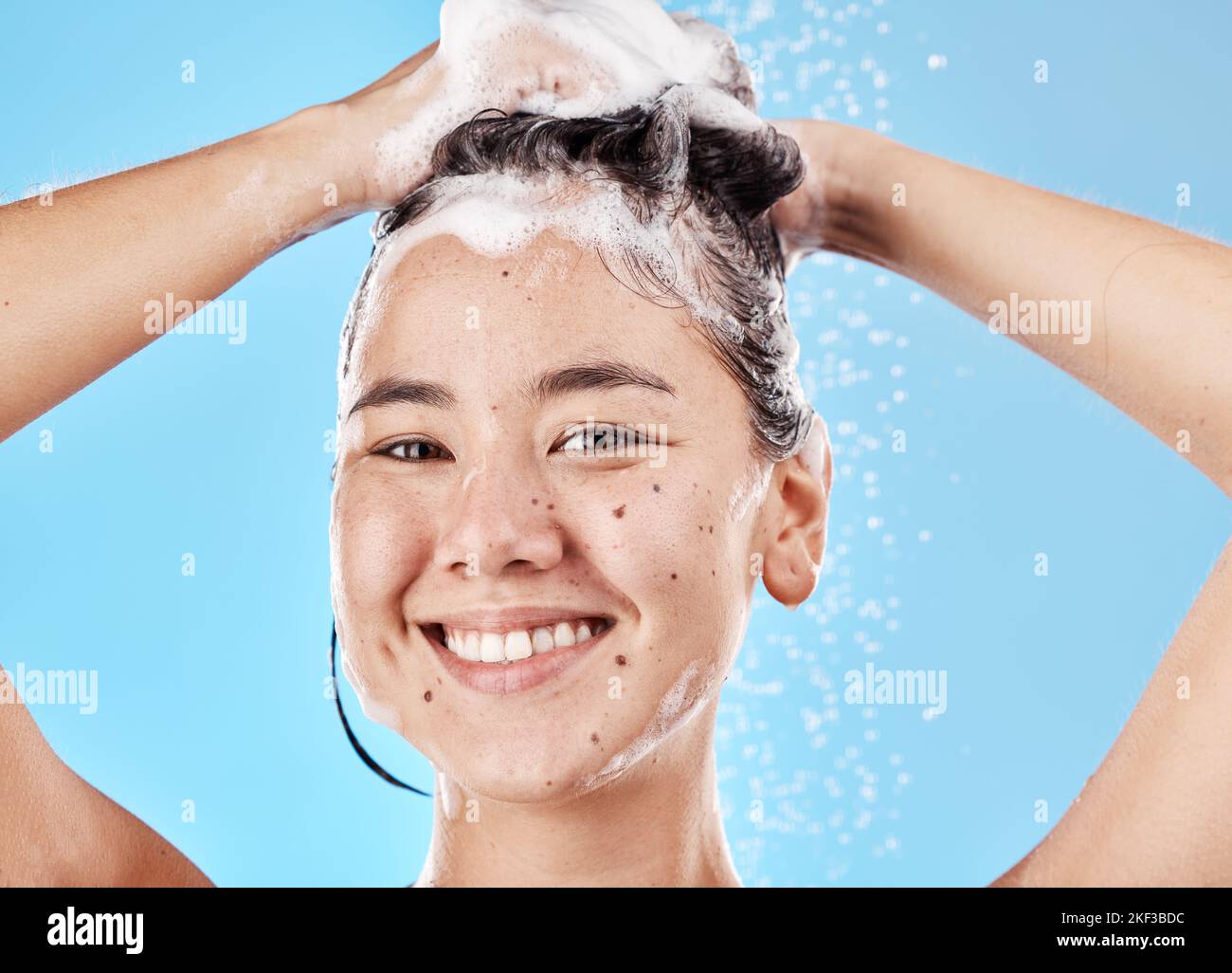 Woman, shampoo and shower in studio portrait with hair care, cleaning ...