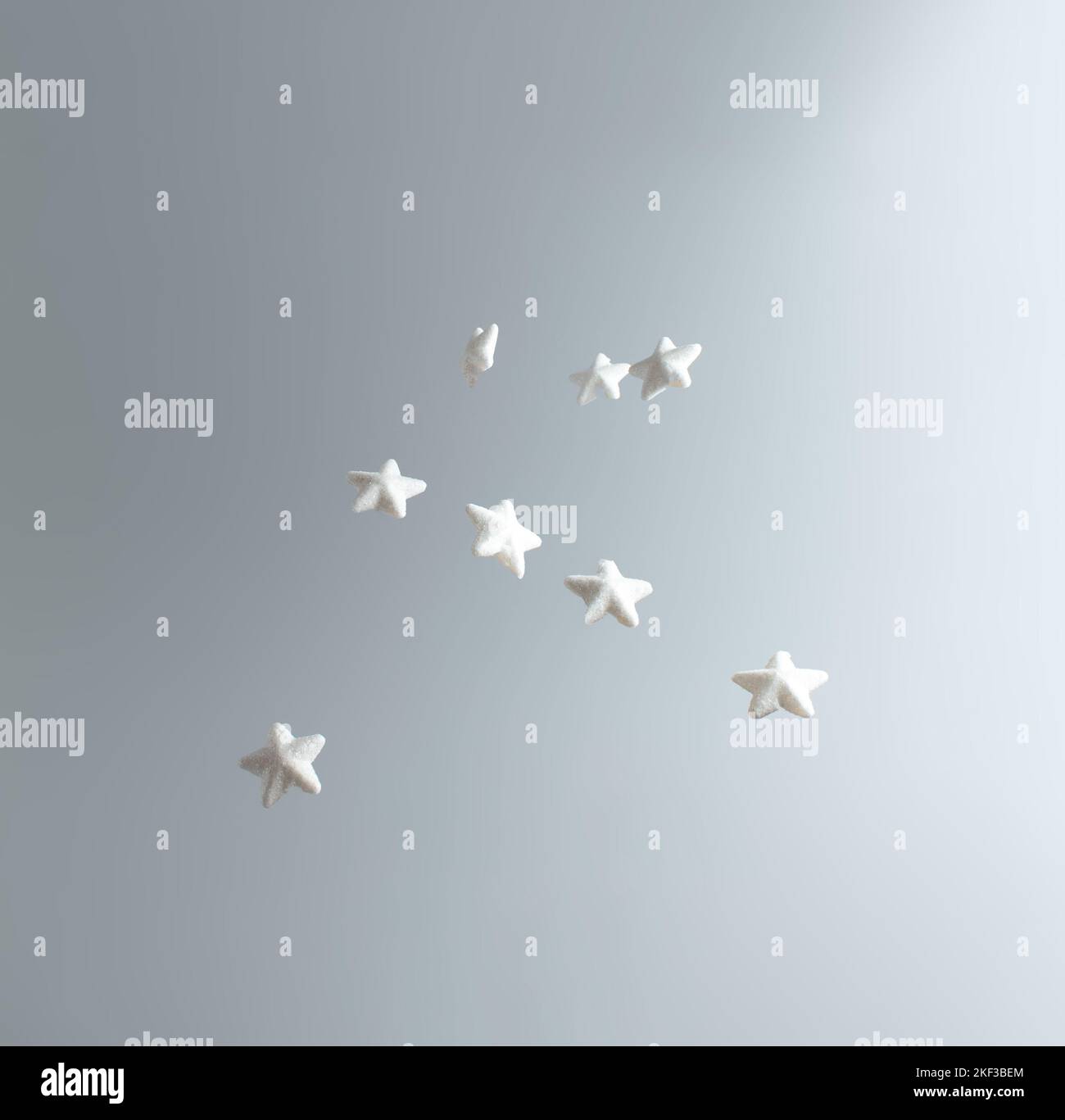 Creative winter scene with white stars. Sunny day concept. Minimal top ...