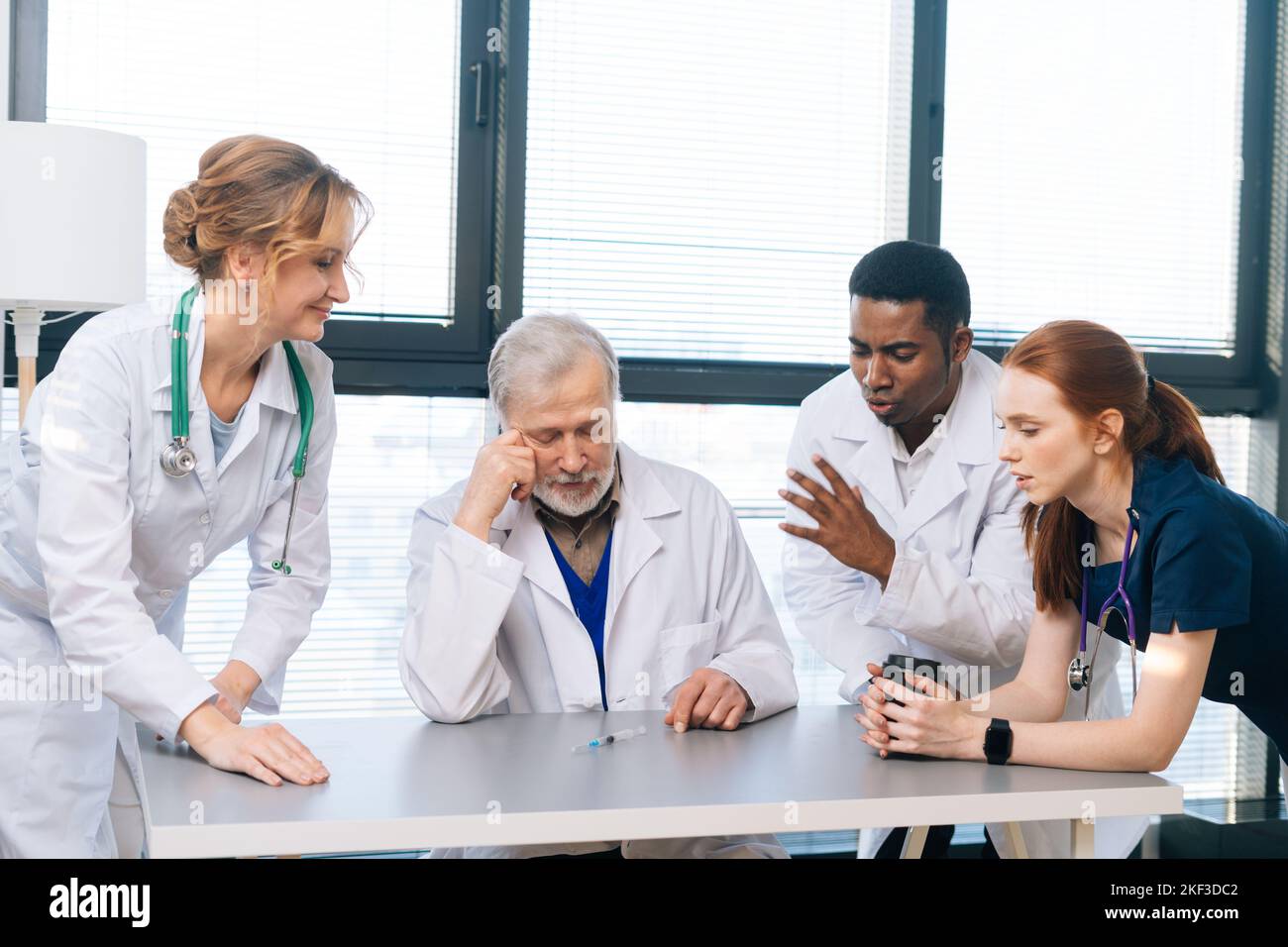 Diverse group of thoughtful multiethnic professional scientist looking ...