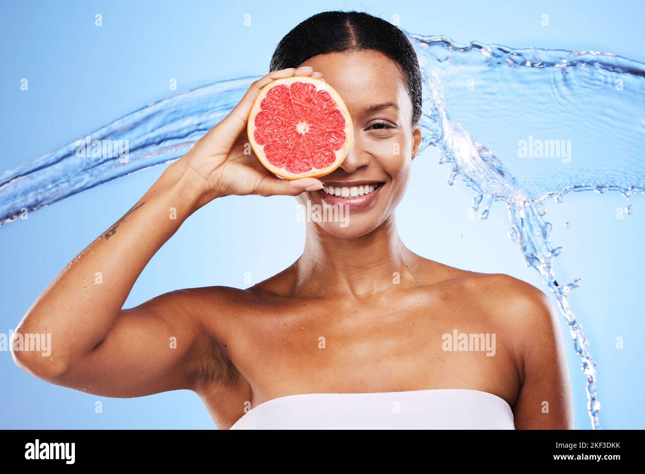 Black woman, grapefruit or smile with water splash for health skincare, wellness or nutrition ...
