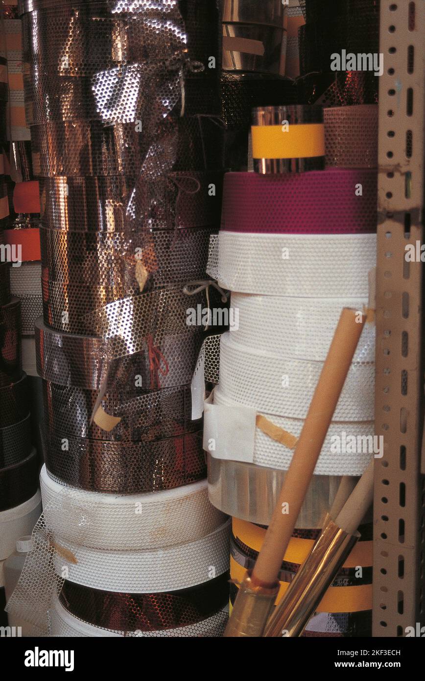 Stacked rolls of disposed perforated materials Stock Photo - Alamy