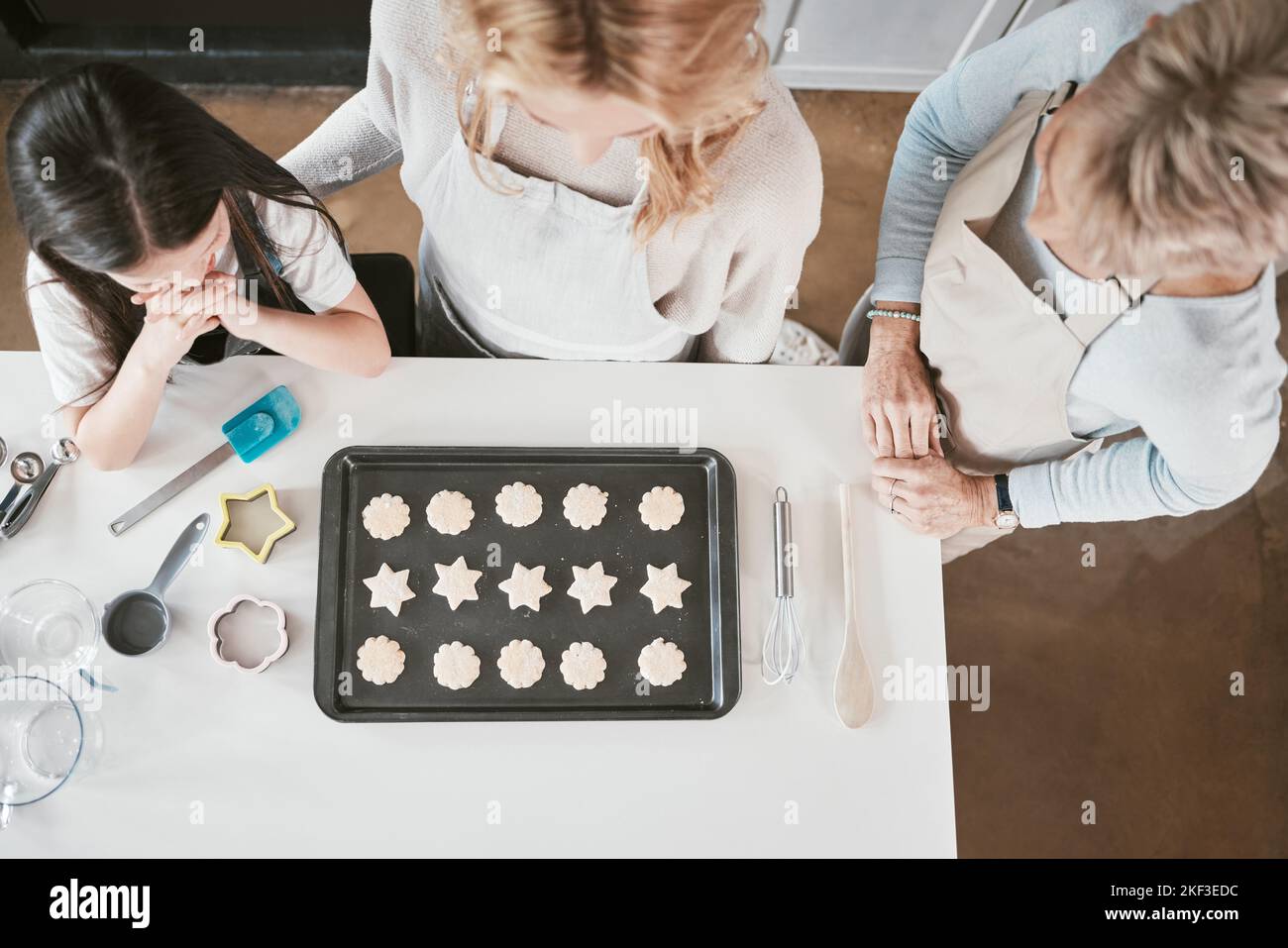 Baking, learning and cookies with family on kitchen counter with girl ...