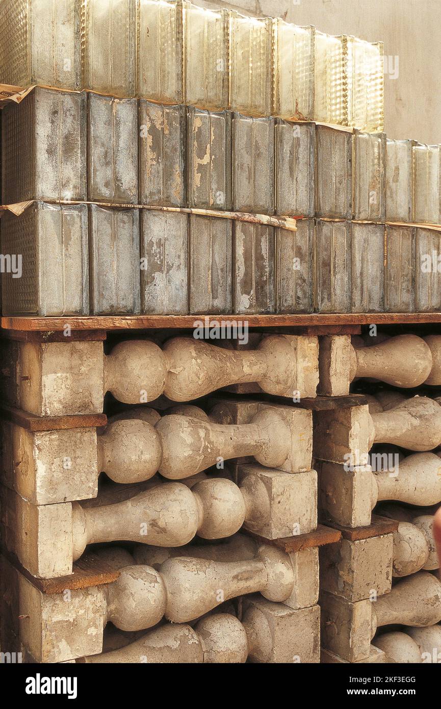 Display of stone balusters and glass bricks Stock Photo - Alamy