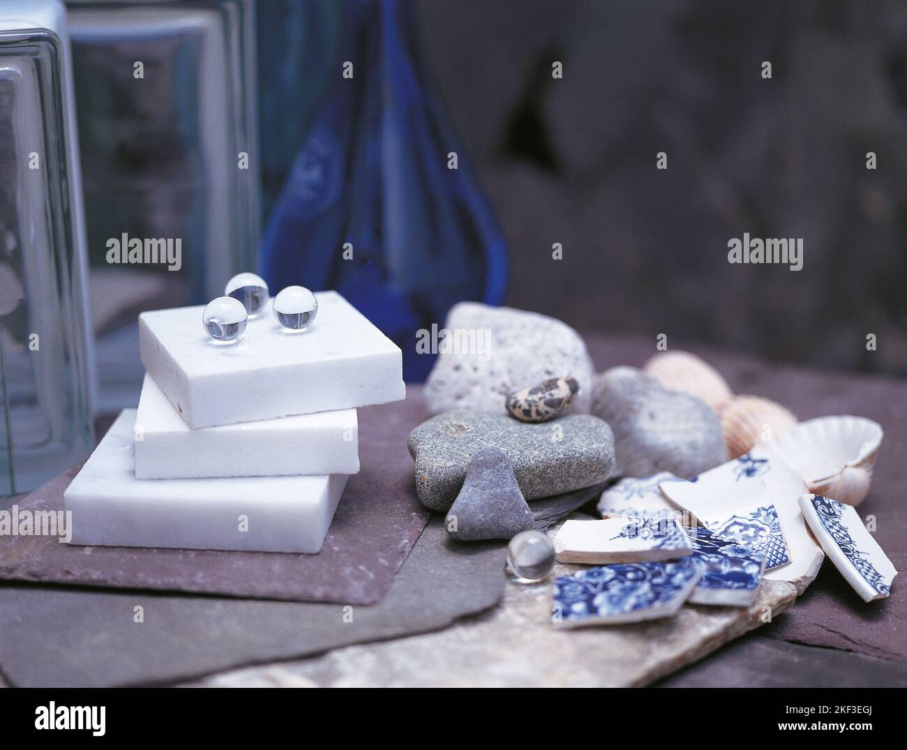 Glass marbles, granite slabs, glass bricks, pebbles and shells Stock ...
