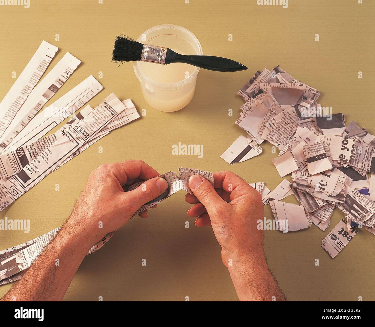 Tearing the strips into smaller squares Stock Photo - Alamy