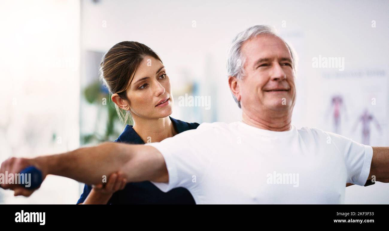 Physical therapy, exercise and physiotherapist with a senior man ...