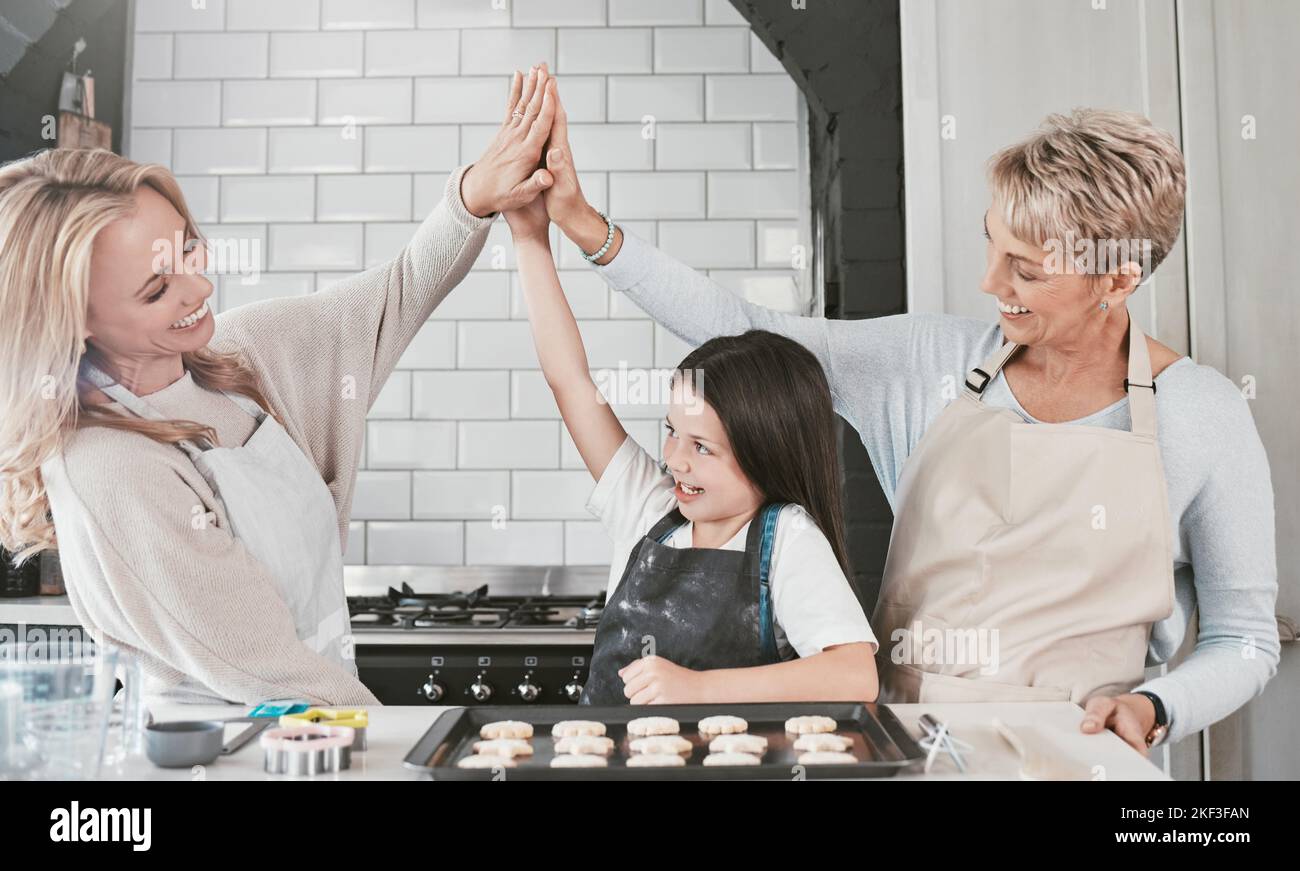 .Baking, high five and child with mother and grandmother for success ...