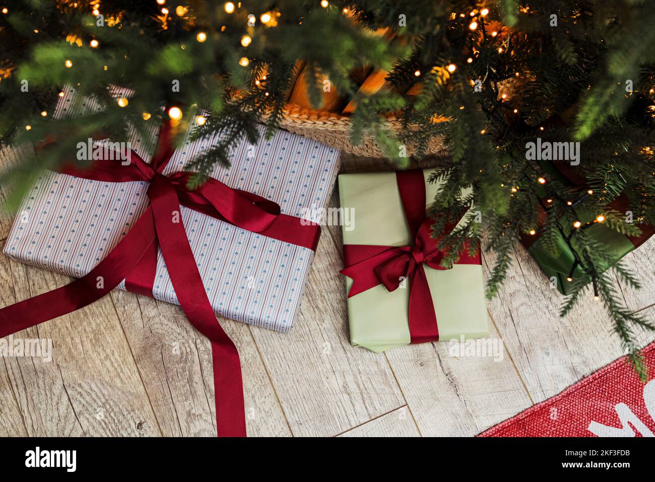 Christmas tree with lights full of gift boxes, view from above. Top ...