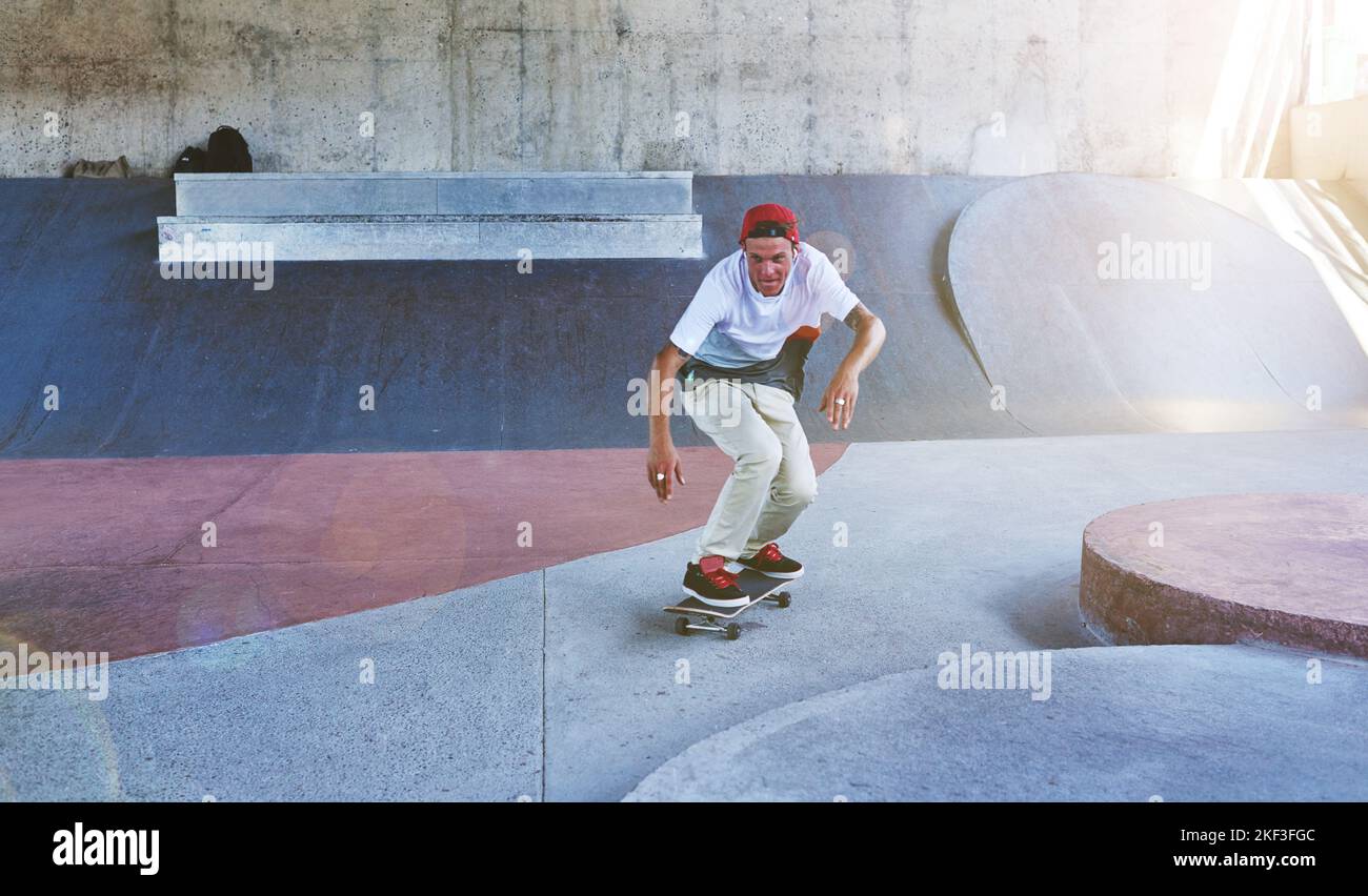 Do more of what makes you happy. a young man skating at a skatepark ...