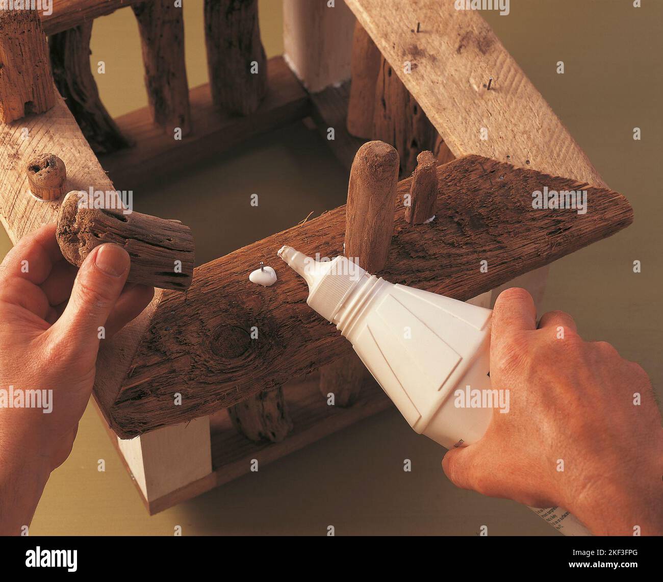 Squeezing some glue on a pin Stock Photo - Alamy