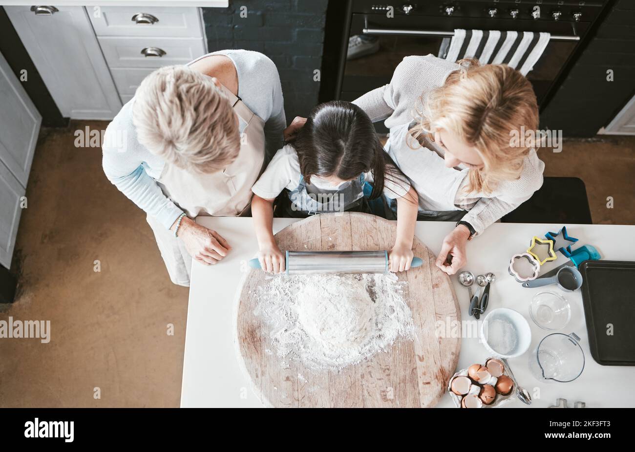 .Top view, baking and girl learning with family, having fun or bonding ...