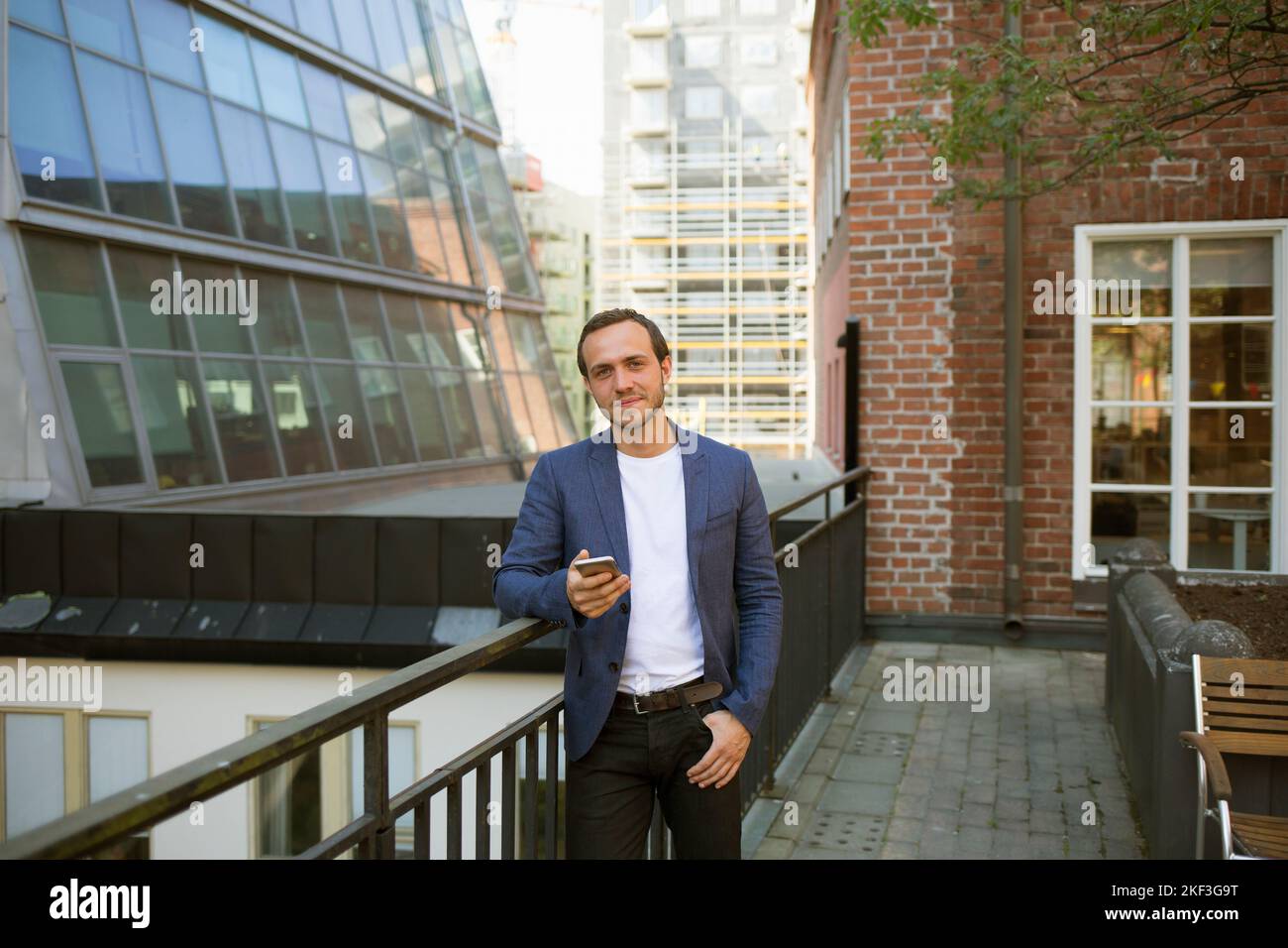 Businessman leaning balcony railing hi-res stock photography and images ...