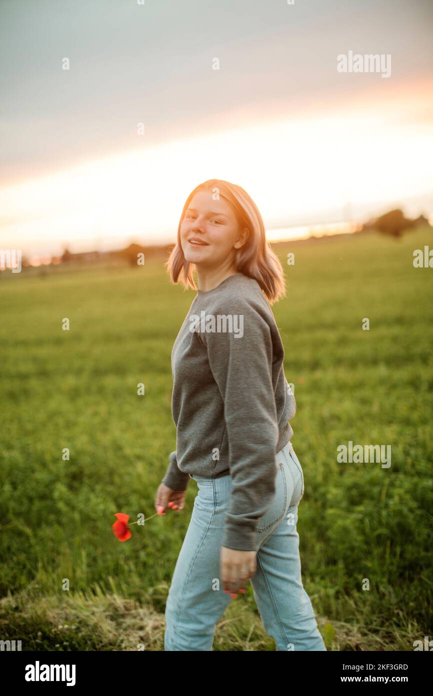 Woman walking in field hi-res stock photography and images - Alamy