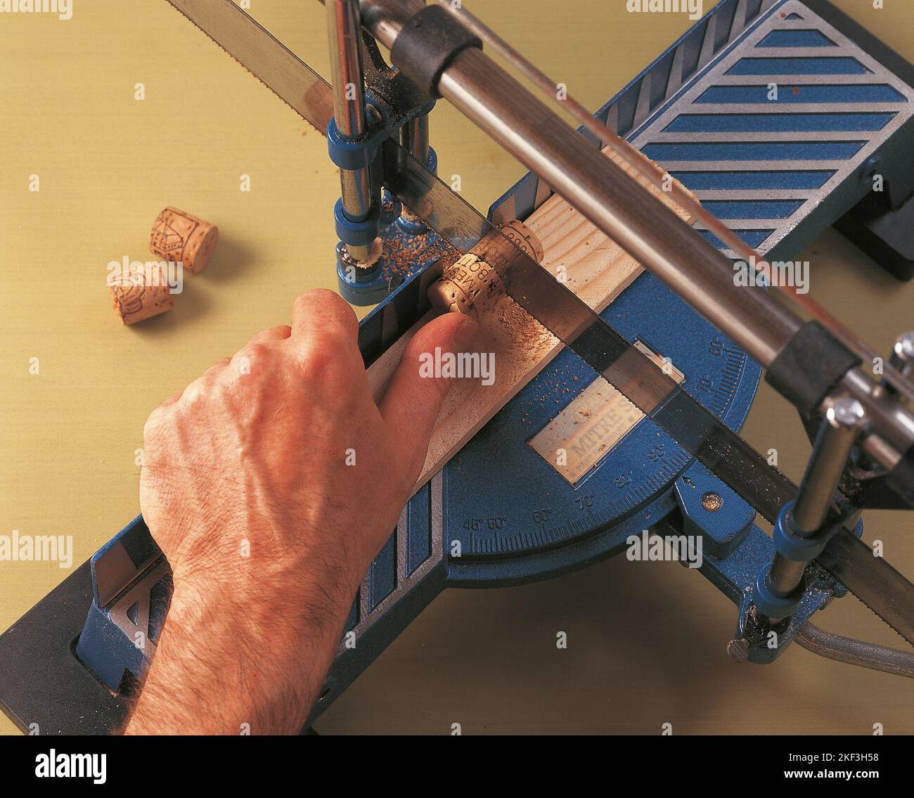Cutting a cork with mitre saw Stock Photo - Alamy