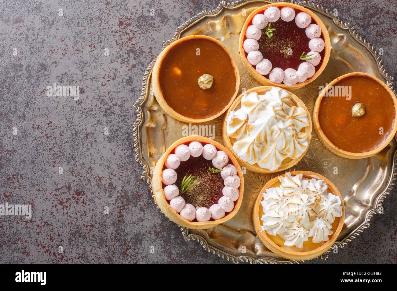 Delicious gourmet sweets tartlets for the holiday with meringue and ...
